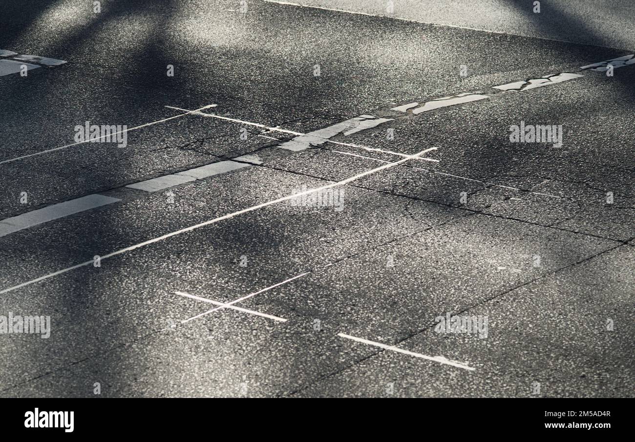 Plain asphalt surface in grey with rectangular white lines and a ...