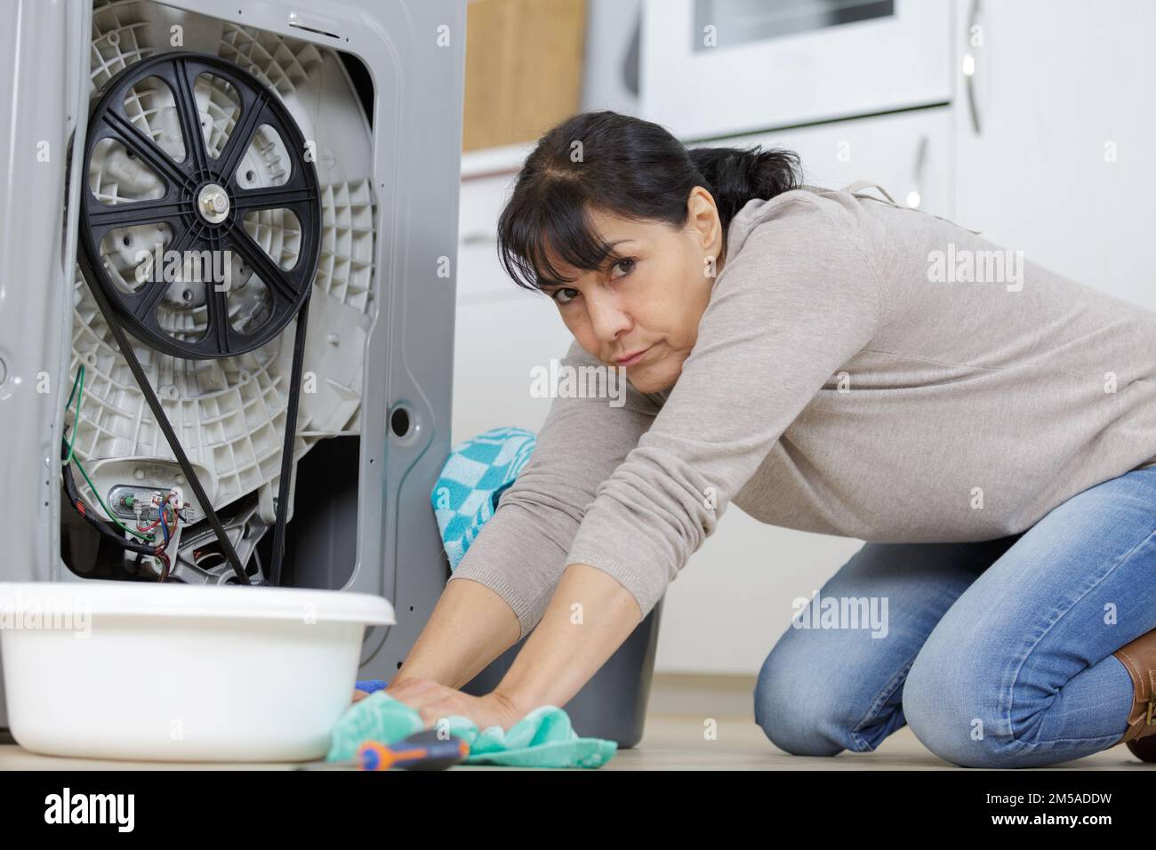 Worried woman cleaning water hi-res stock photography and images - Alamy