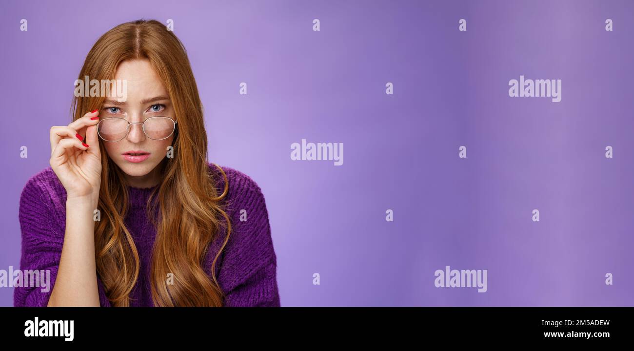 Questioned and unsure cute smart female detective with ginger hair ...