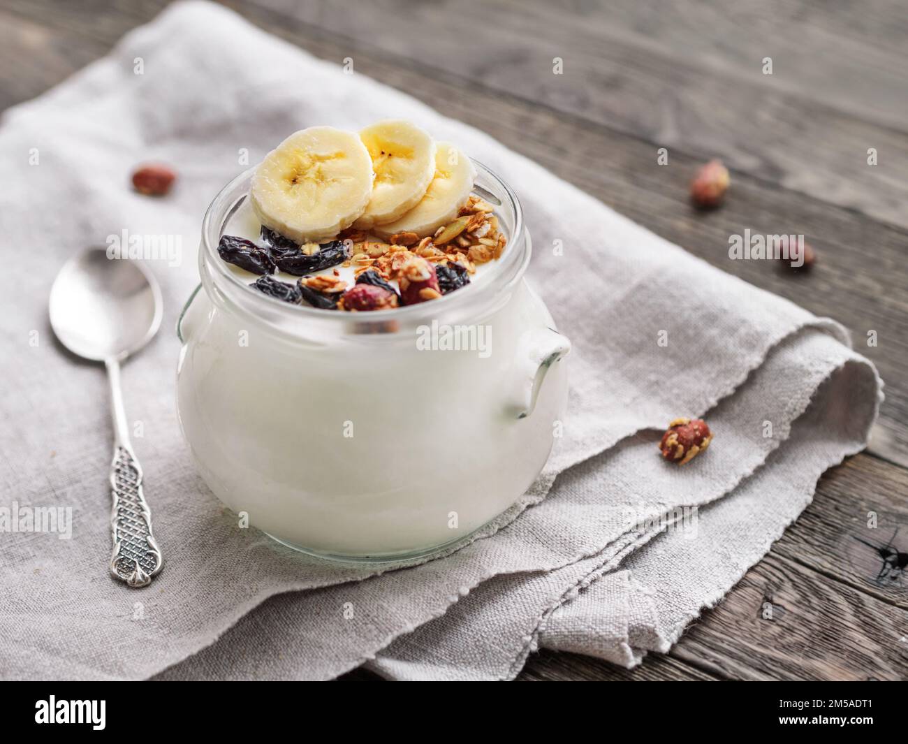 Natural homemade yogurt in a glass jar. Healthy food for breakfast with ...