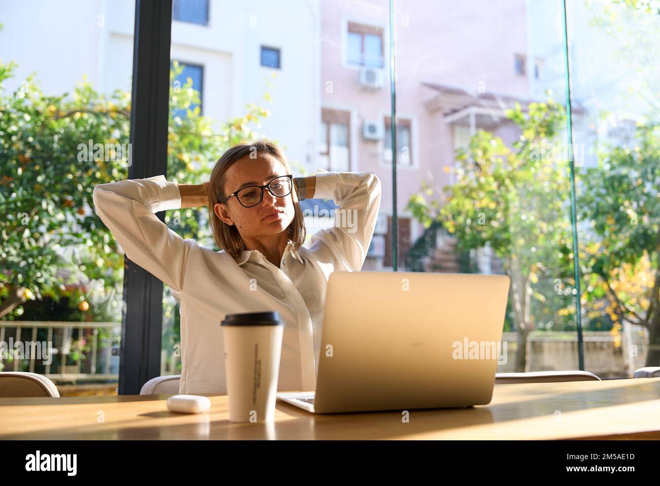 Happy female designer finishing work Stock Photo - Alamy