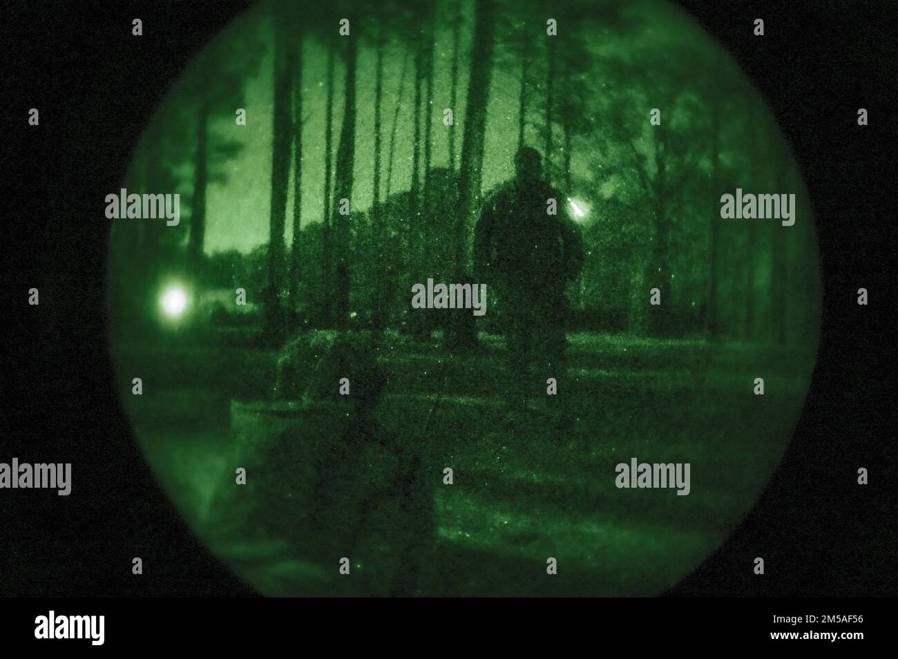 An Airman from the 822nd Base Defense Squadron, lays in the prone ...