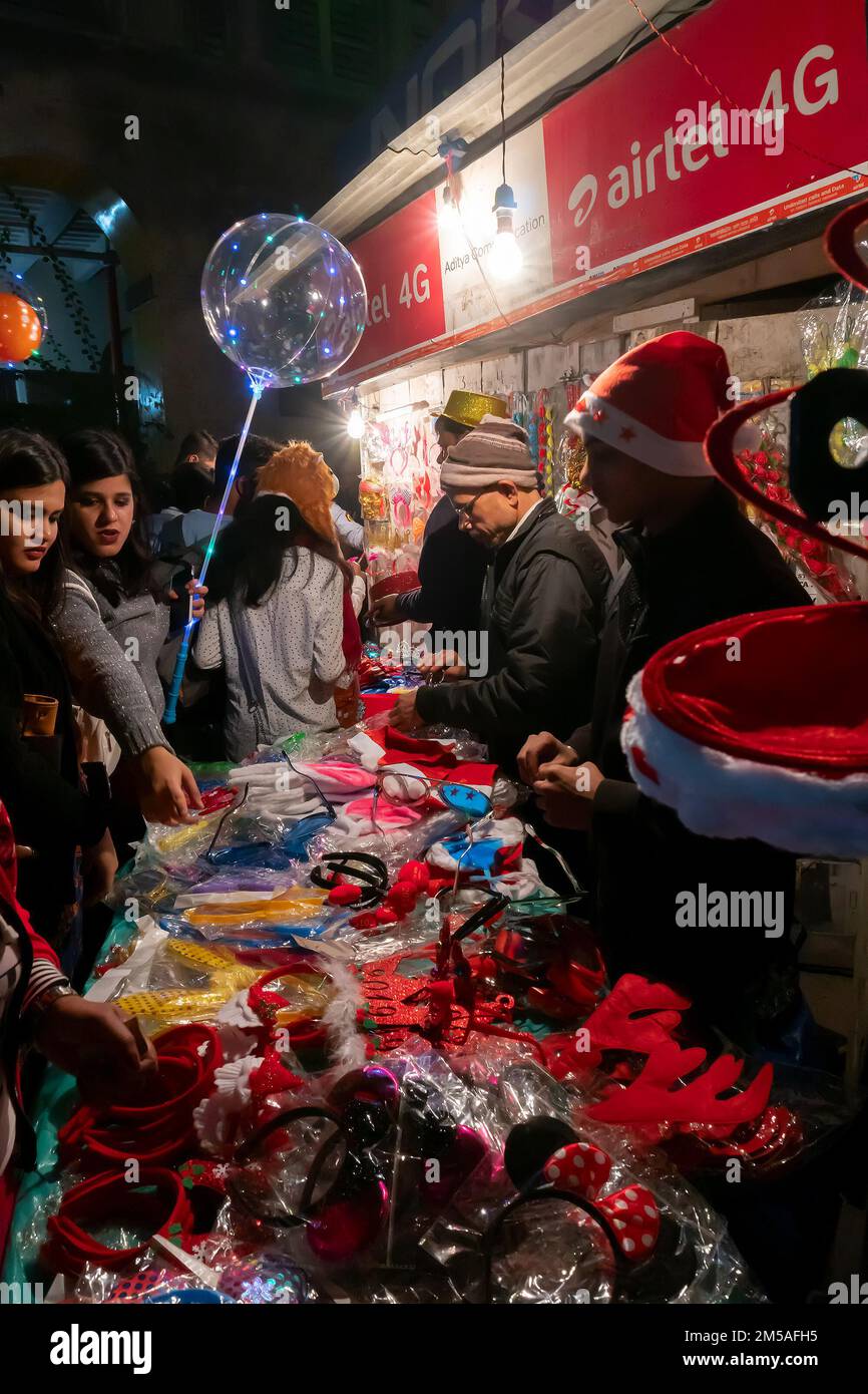Kolkata, West Bengal, India - 25.12.2018 : Young people buying red hats ...