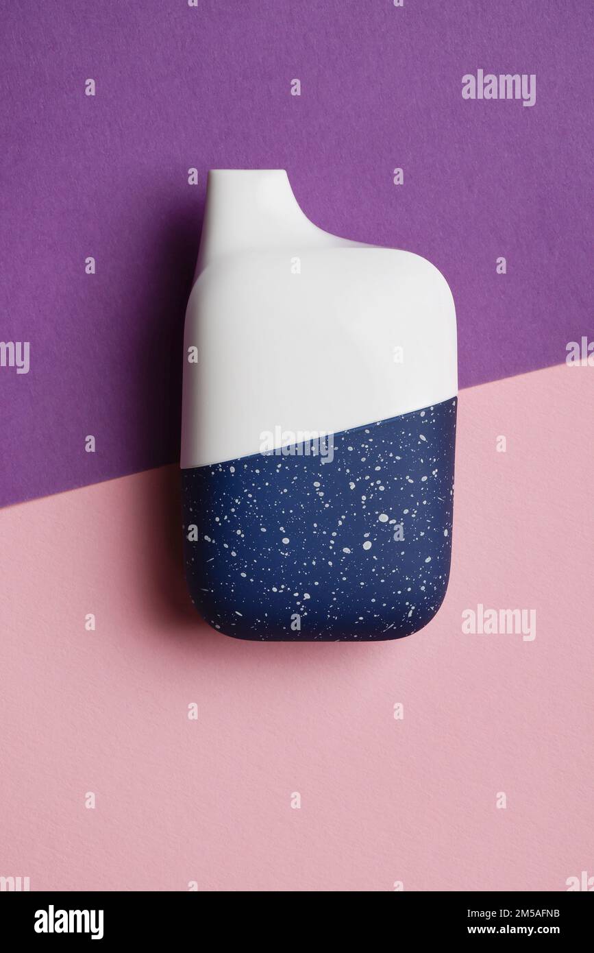 disposable electronic cigarette or vape on purple background. top view ...