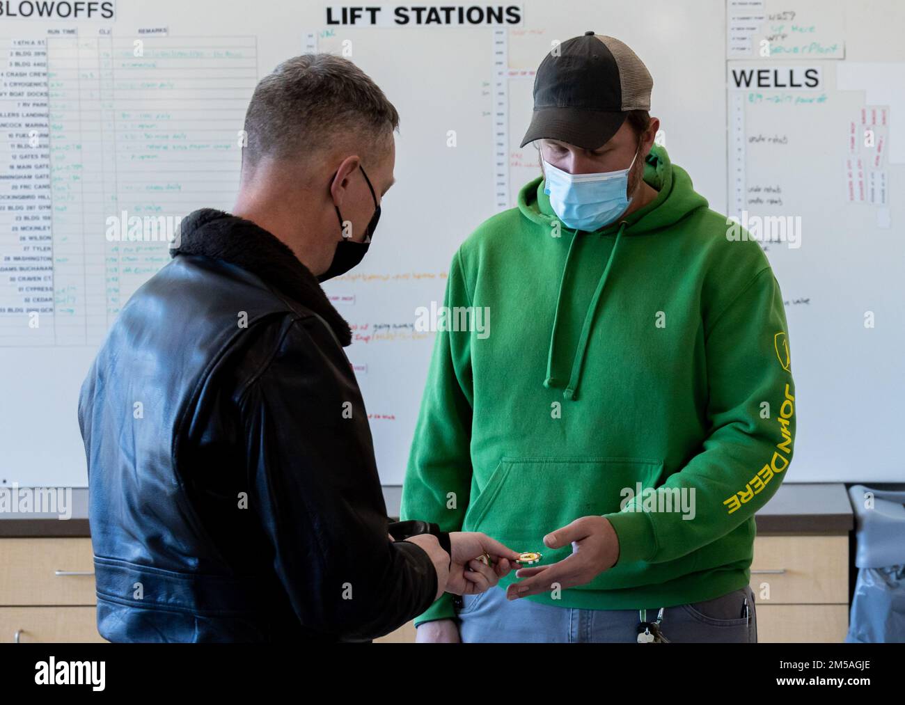 Timothy Bert, a utility systems operator work leader, is given an ...