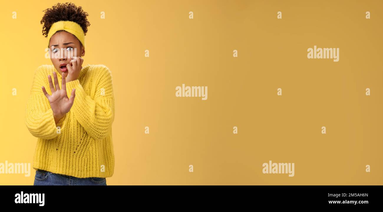 Terrified female victim scared abuse look afraid frightened extend arm ...