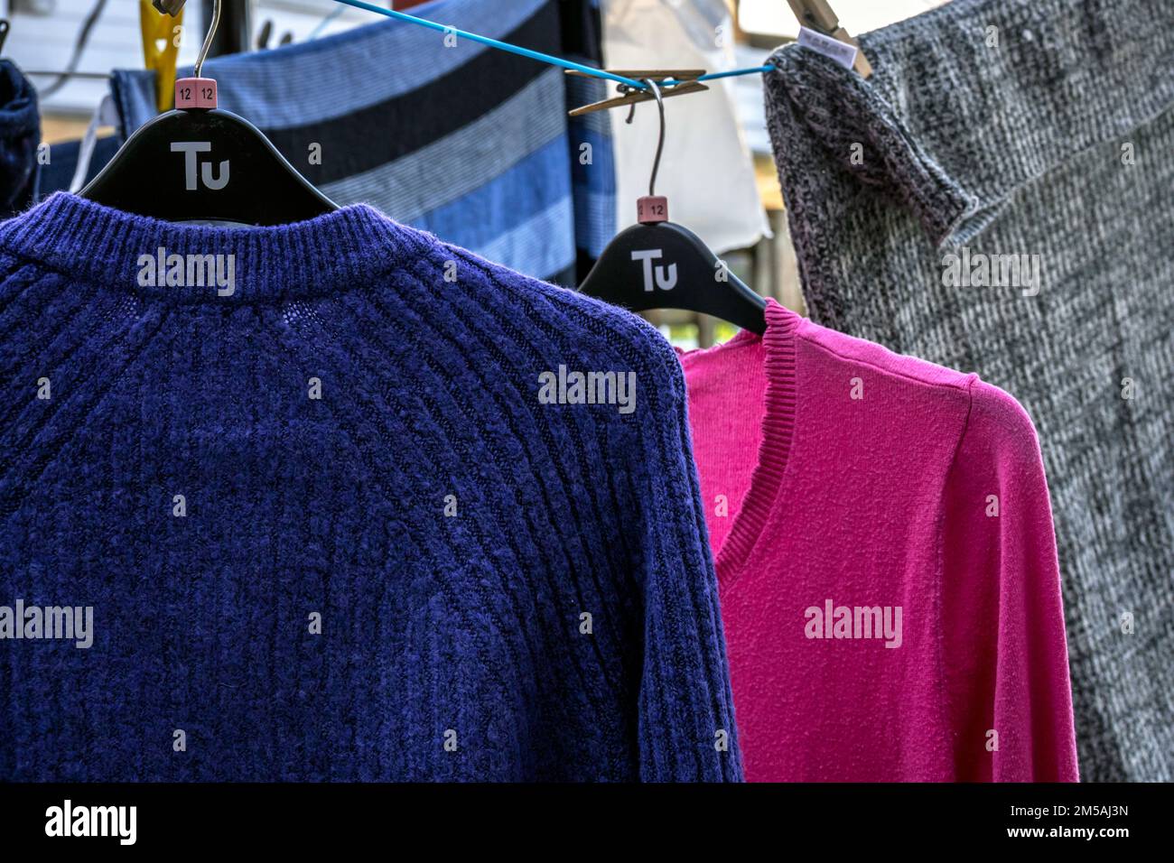 Clothes hanging on washing line Stock Photo - Alamy
