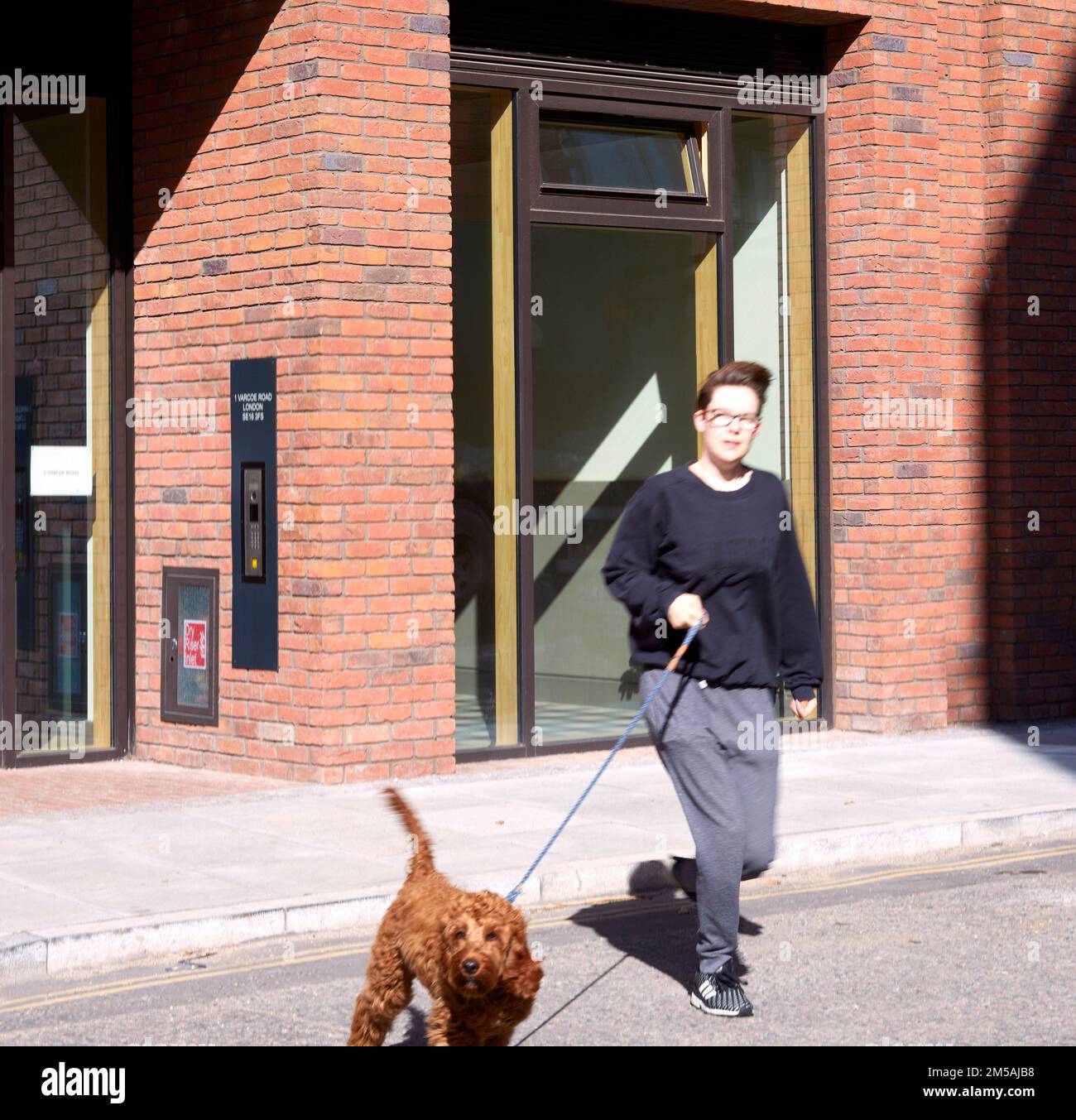 Entrance with passing figure. Varcoe Road, London, United Kingdom ...