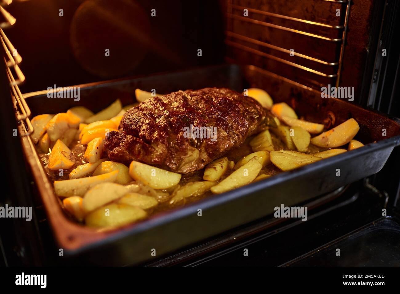 Meat in seasoning ready for baking in the oven. Cooking homemade meat ...