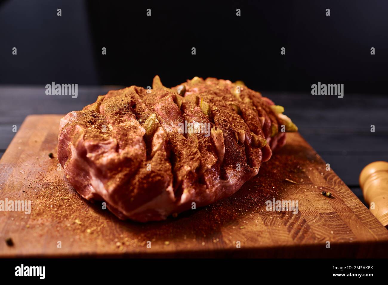 Meat in seasoning ready for baking in the oven. Cooking homemade meat ...