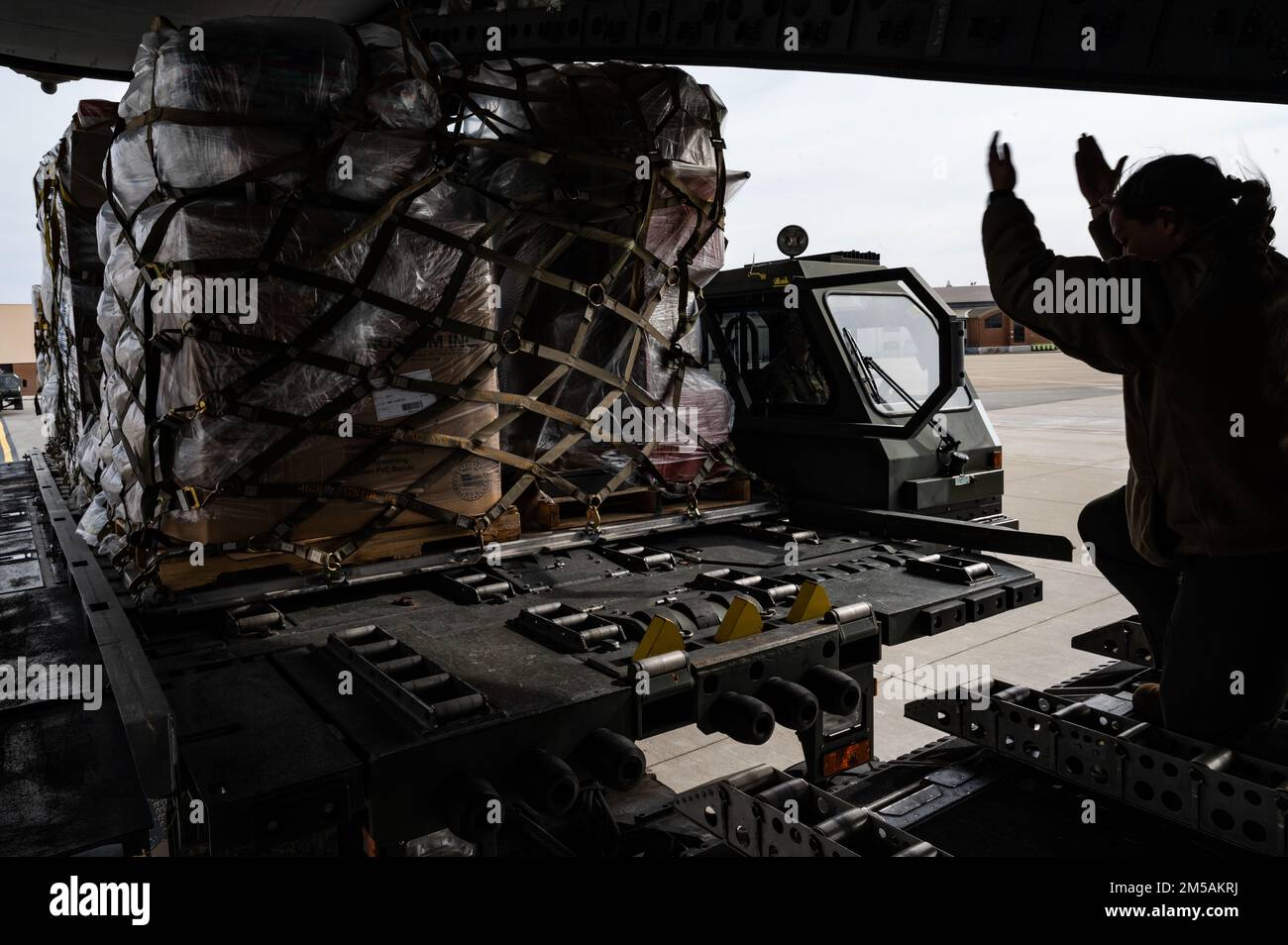 Senior Airman Josie Pitts, 758th Airlift Squadron loadmaster, directs ...