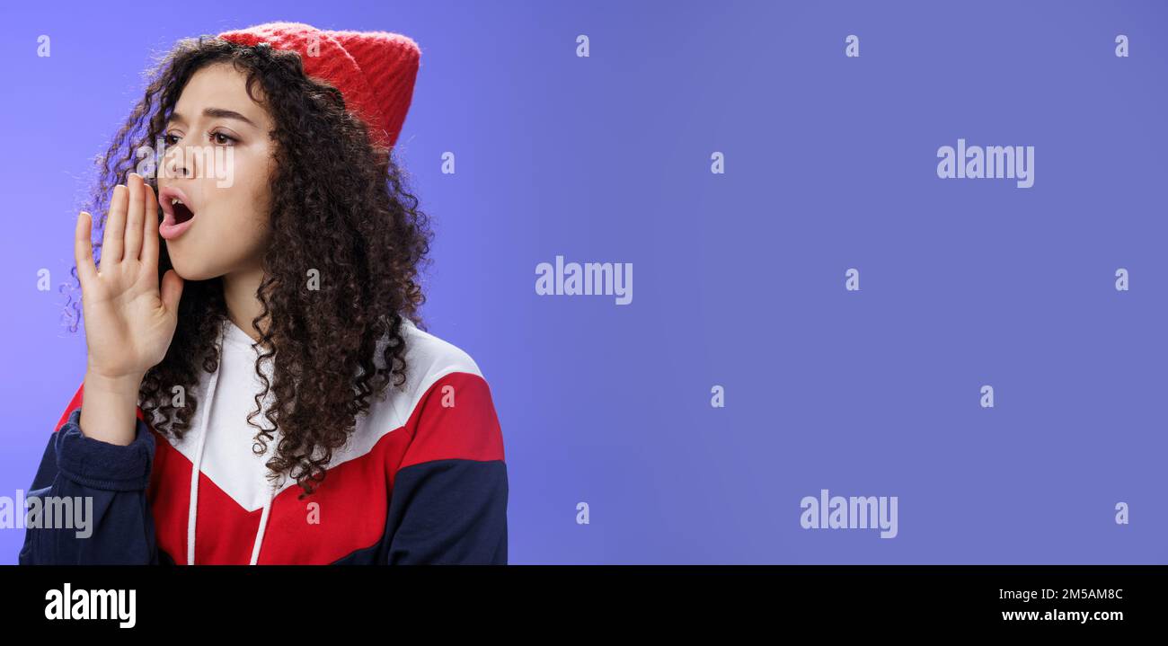 Portrait of worried sister calling sibling outdoors open mouth looking ...