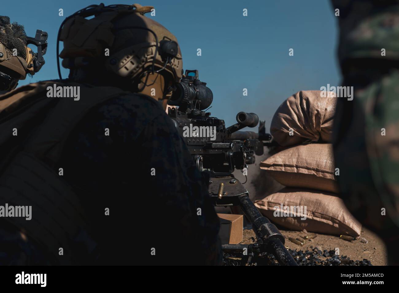 A U.S. Marine with the Advanced Machine-Gun Course fires a M240G medium ...
