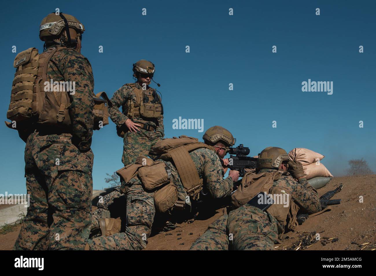 U.S. Marines with the Advanced Machine-Gun Course, fire an M240G medium ...