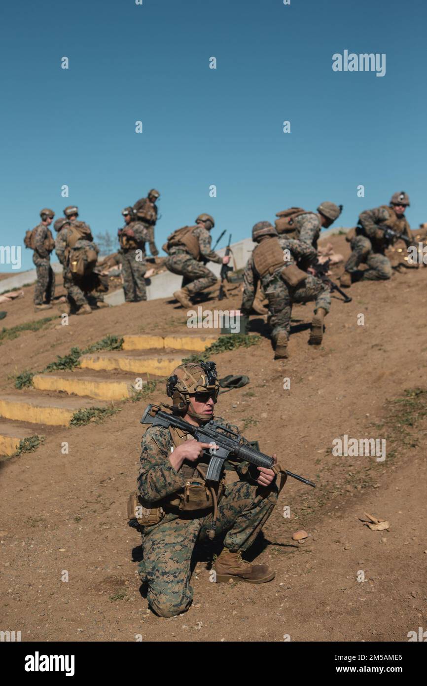 A U.S. Marine with the Advanced Machine-Gun Course sets security during ...