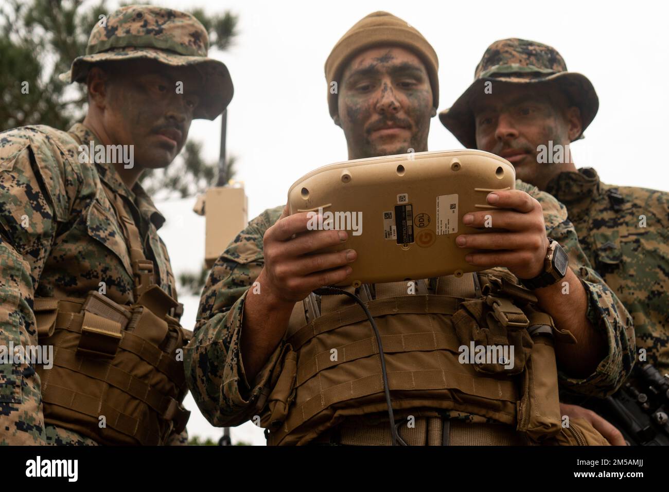 U.S. Marines with 1st Battalion, 3d Marines, 3d Marine Division, track ...