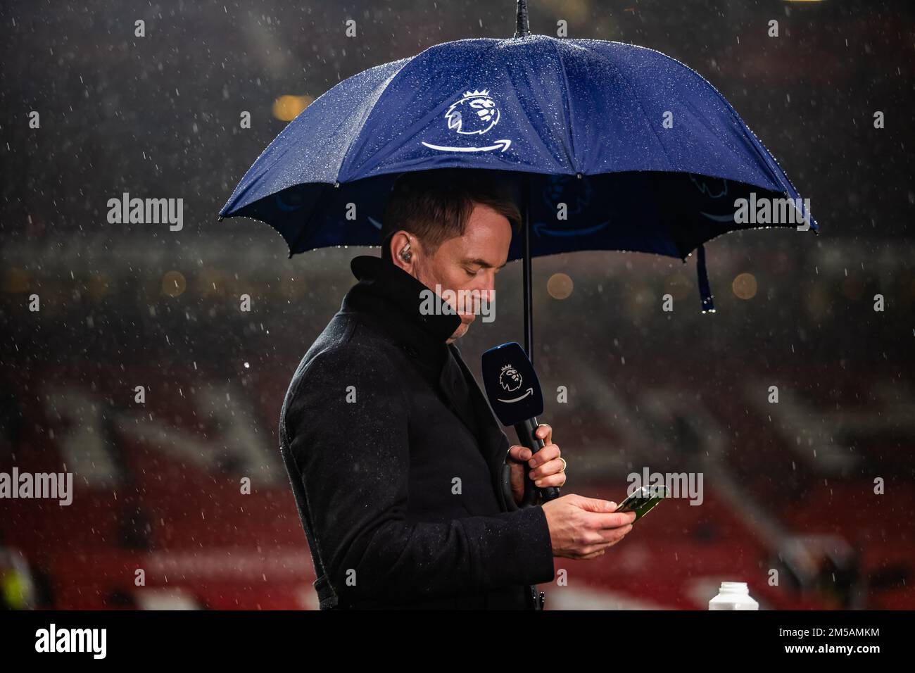 Simon Thomas checks his phone before going live on air before the ...