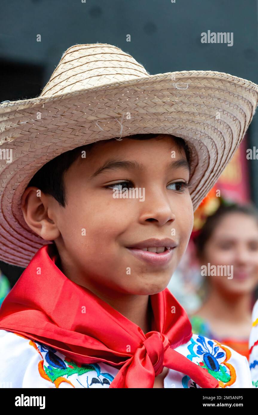 Portrait of a male child wearing traditional clothes as he performs in ...