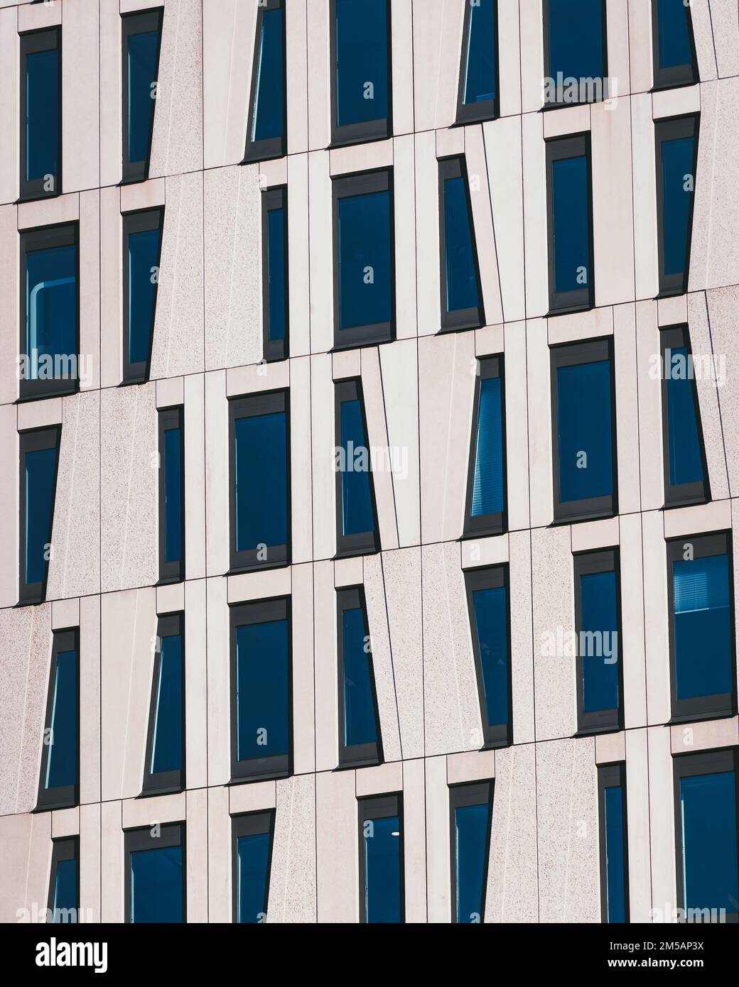 the exterior of a building with abstract asymmetrical windows Stock ...