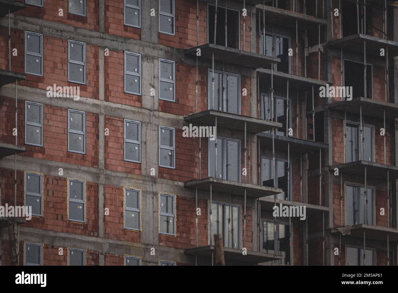 A scene of the brick semi-constructed apartment building with newly ...