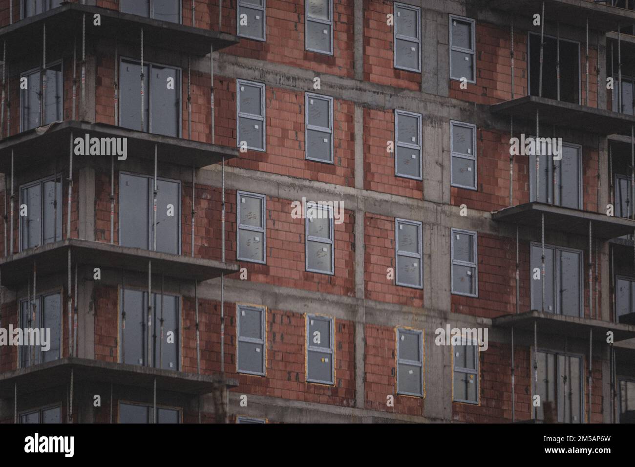A scene of the brick semi-constructed apartment building with newly ...