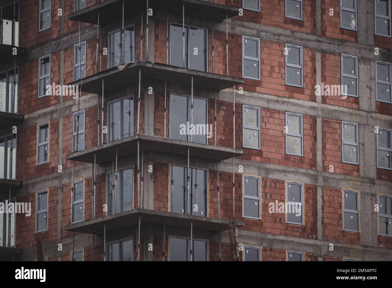 A scene of the brick semi-constructed apartment building with newly ...