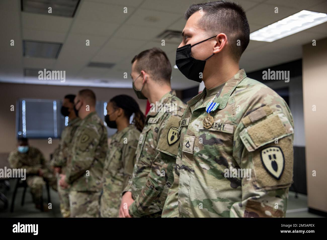 U.S. Army Private 1st Class Roman Garza is awarded an Army Achievement ...