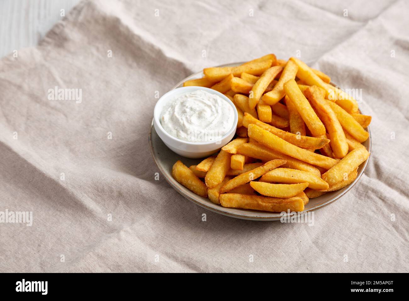 Homemade French Fries with Ranch Dressing on a Plate, side view Stock ...