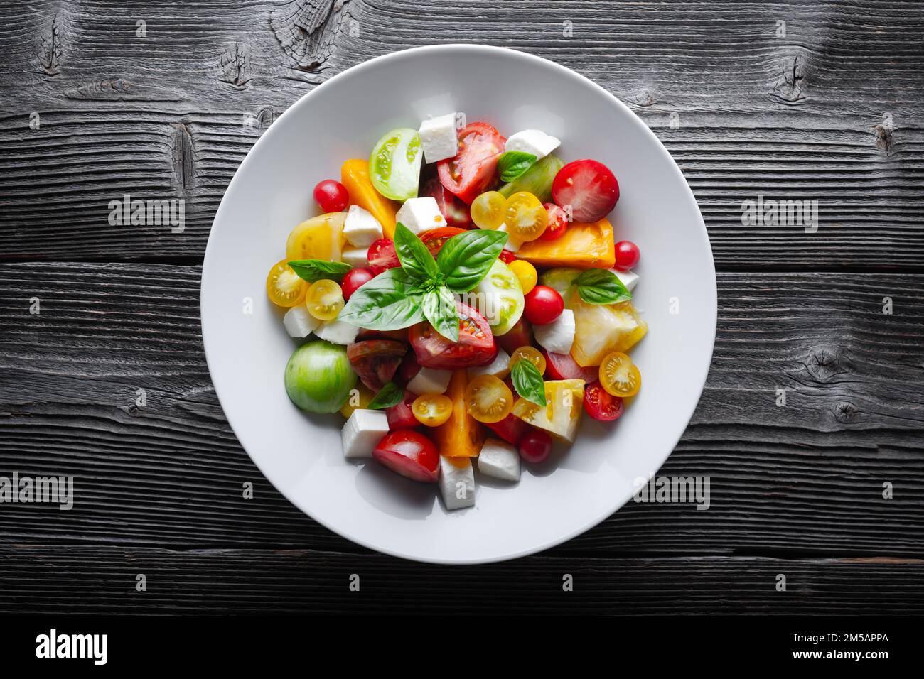 Salad with different varieties kind of red, yellow, green and black ...