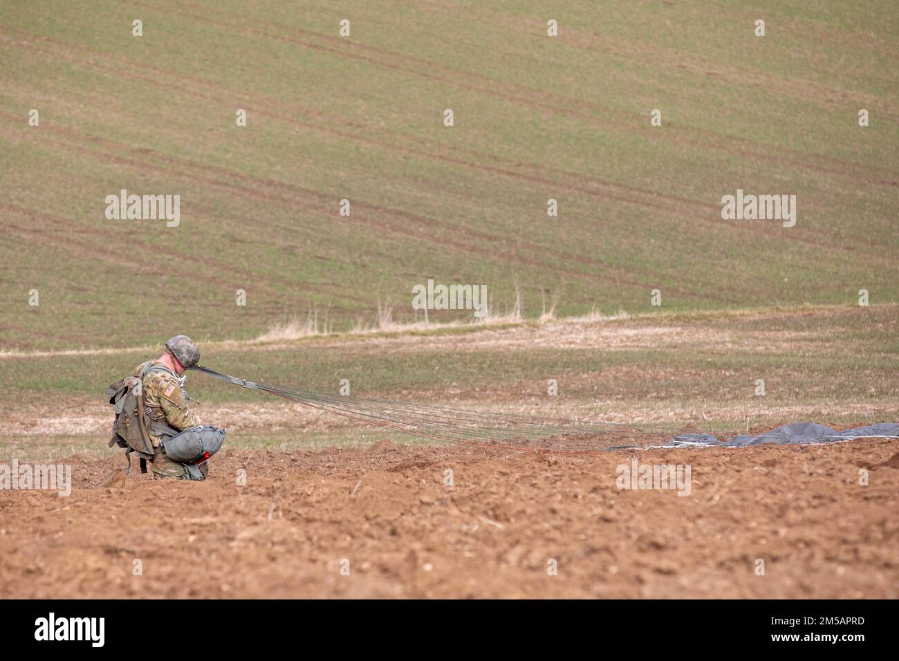 A U.S. Army Soldier completes post landing procedures after a static ...