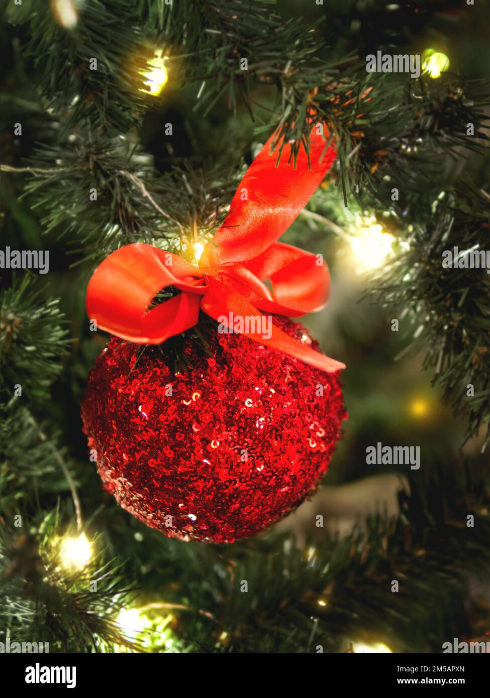 Christmas tree with shiny decorations. Fir tree decorated with bright ...