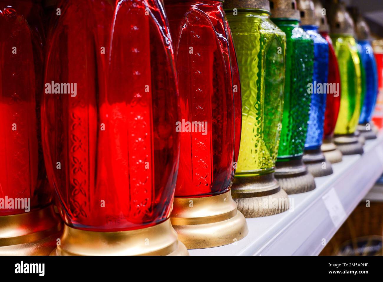 Multi-colored lamps are on sale at the supermarket counter Stock Photo ...