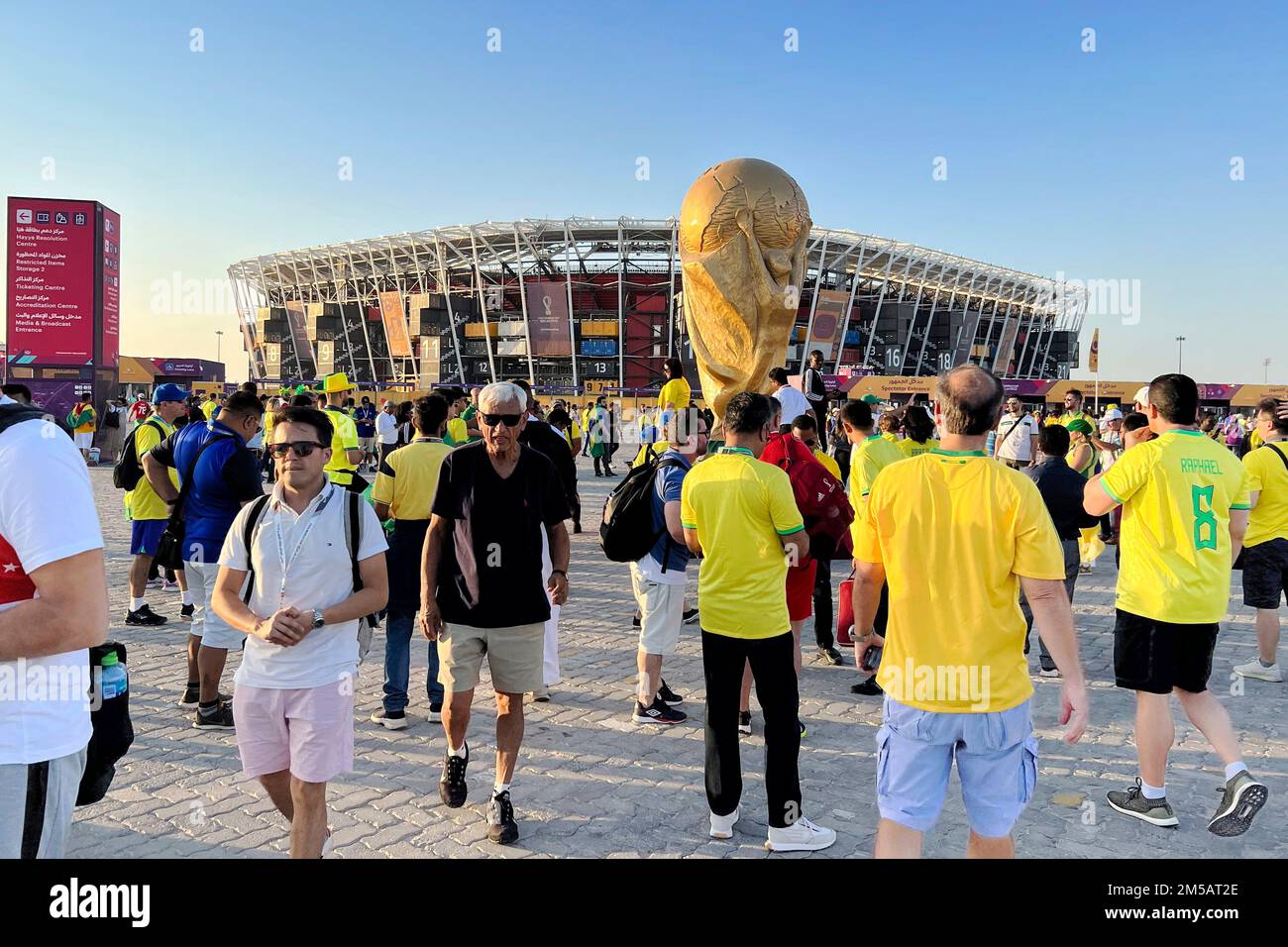 Fans, football fans in front of a giant trophy in front of Stadium 974 ...