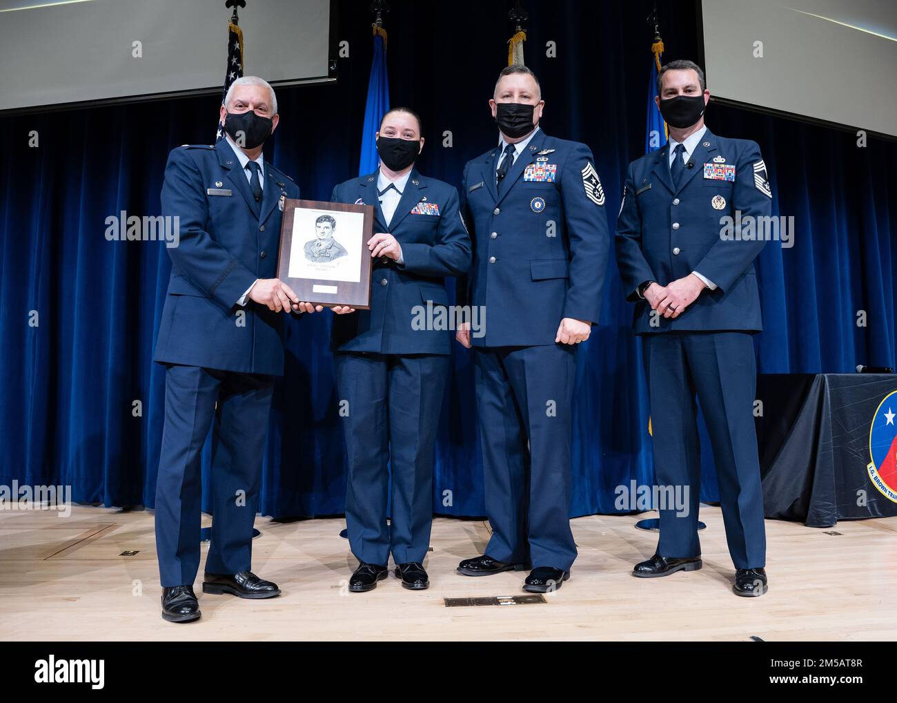 U.S. Air Force Tech. Sgt. Erin Winkler receives the John L. Levitow ...