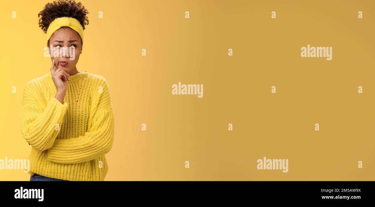 Perplexed unsure cute timid african-american female thinking how escape ...