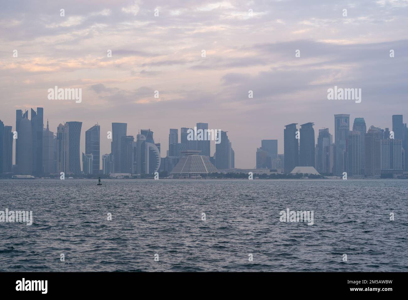 A hazy view of the city of Doha in Qatar, Middle East. The skyline of ...