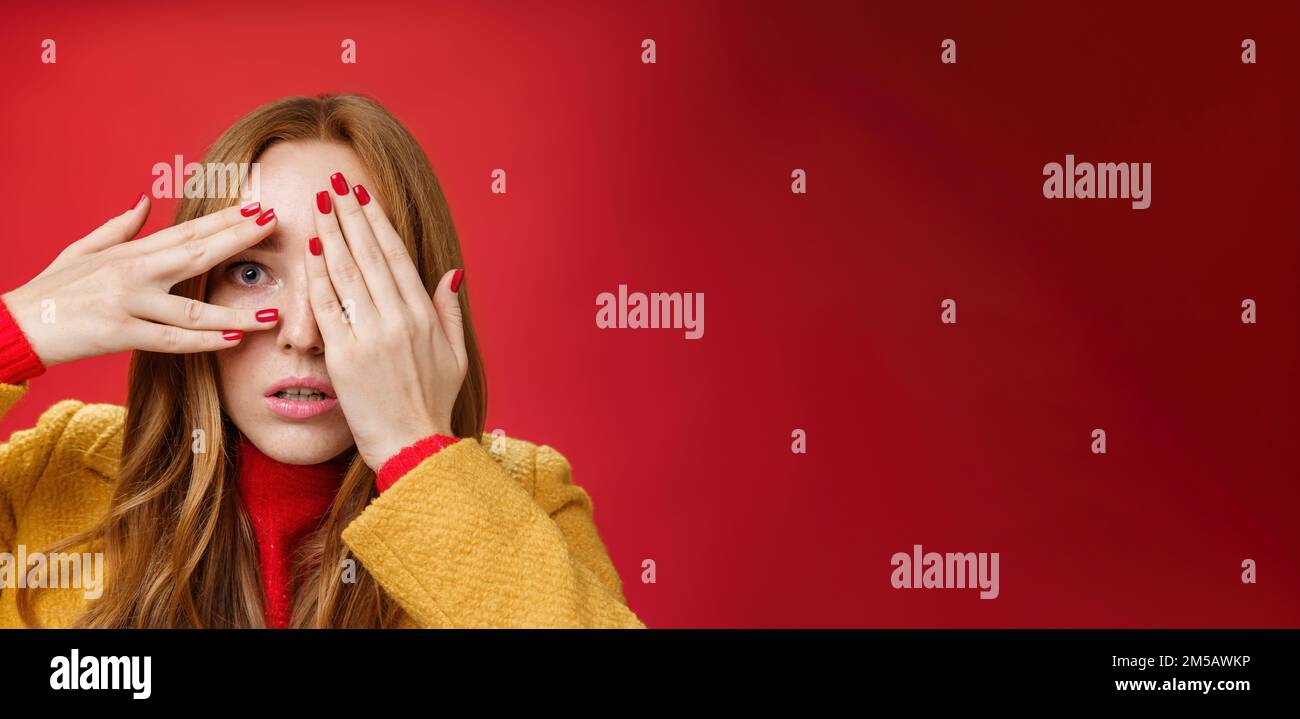 Stunned and shocked redhead woman cannot believe what terrible thing ...