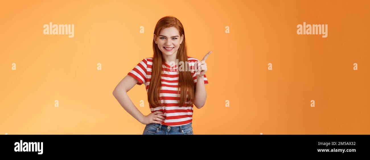 Cheerful sly redhead girlfriend have something interesting on mind ...