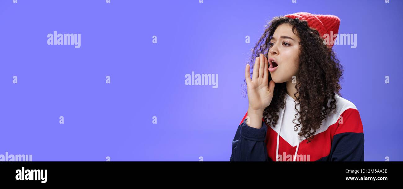 Portrait of worried sister calling sibling outdoors open mouth looking ...