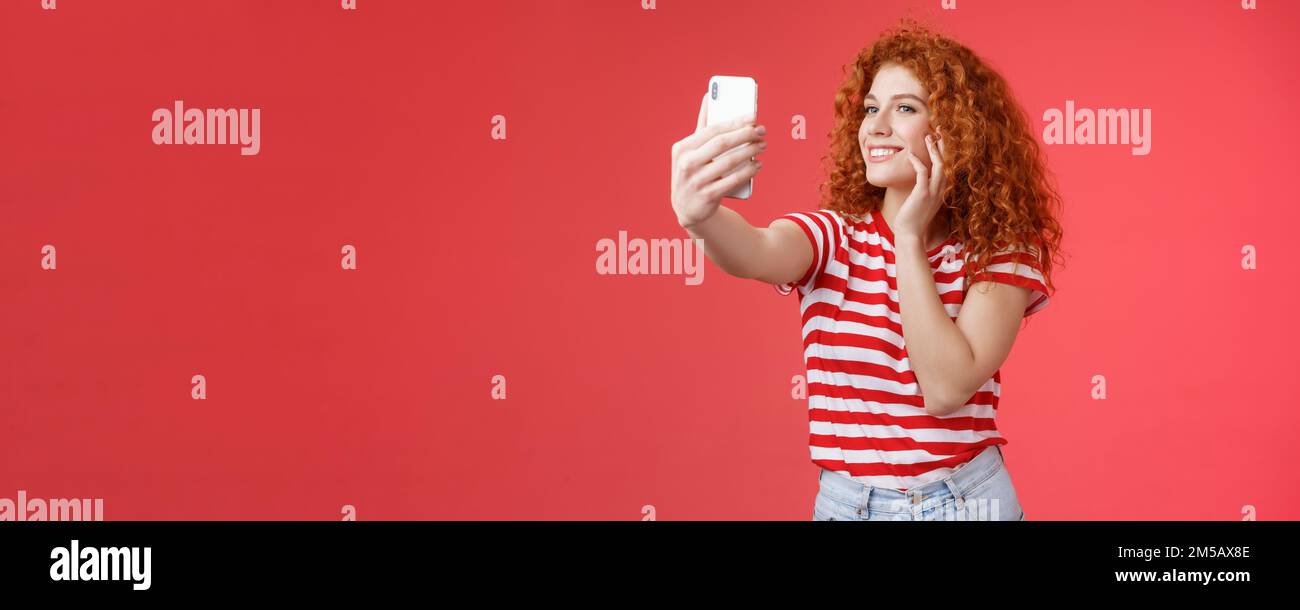 Popular cheerful good-looking stylish female blogger redhead curly ...