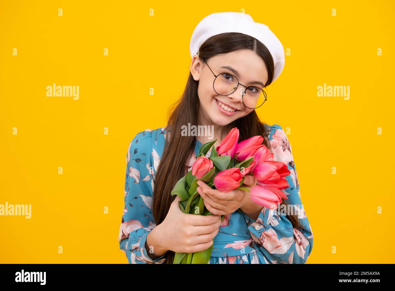 Child girl with tulips, mothers or womens day. Kid hold flowers for 8 ...