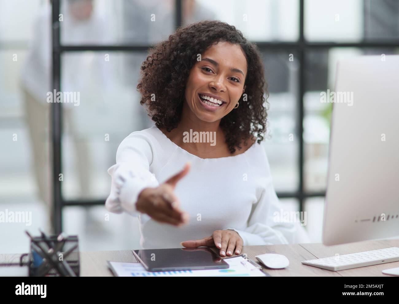 businesswoman offering handshake, standing with extended hand in Stock ...