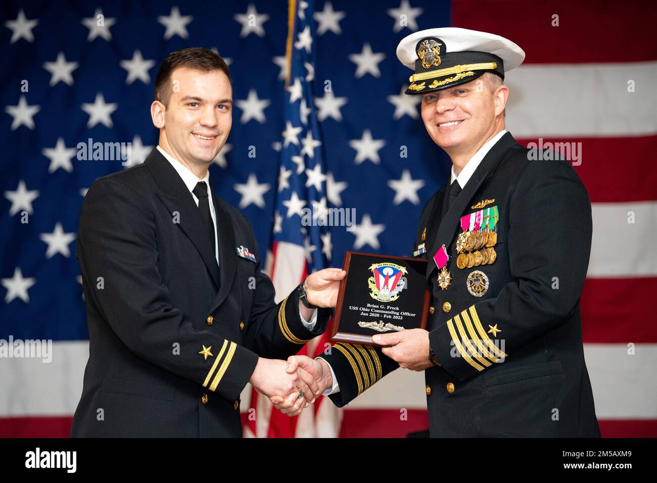Capt. Brian Freck, right, receives a plaque during a change of command ...