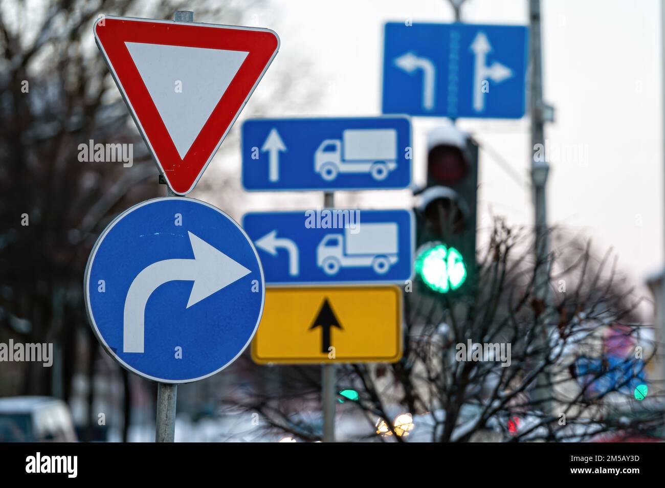 Cars moving on the road in city in winter. View to the traffic with ...