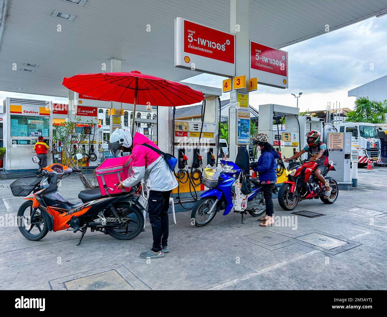 Phuket, Thailand, People Filling Motorcycles with Gas at Local Shell ...