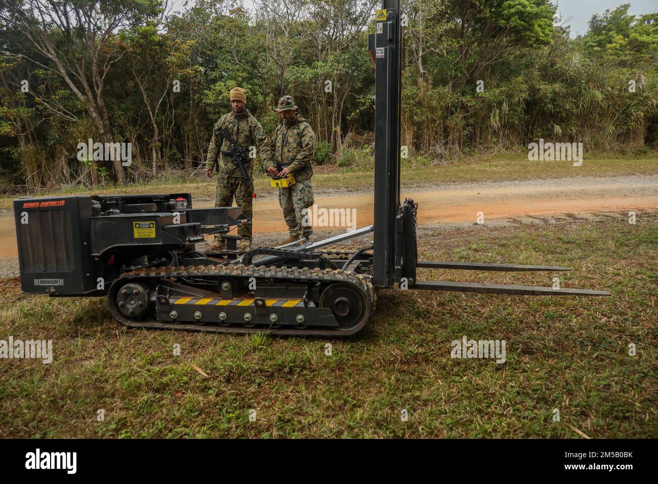 U.S. Marine Corps Staff Sgt. Chaz Haynesworth (left), a motor vehicle ...