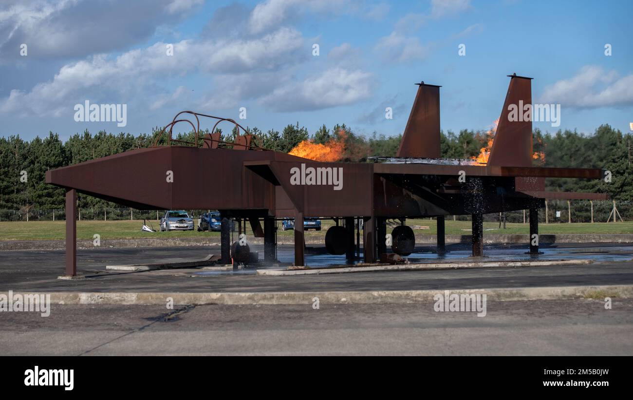 A model F-15 frame catches fire in preparation for a simulated aircraft ...