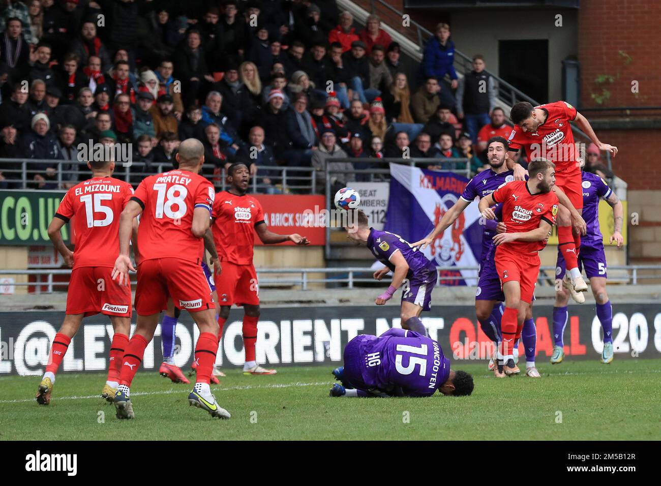 London, UK. 27th Dec, 2022. Dan Happe of Leyton Orient rises to head on ...