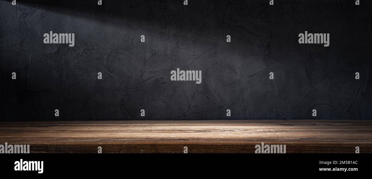 Wooden table or counter top with black stone wall background Stock ...