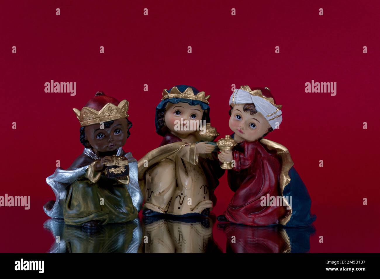 Happy Three King's Day. Three wise men on dark red background. Concept ...